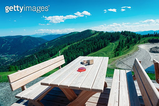 Open air cafe with wooden tables and chairs in Alps mountains in Bad ...