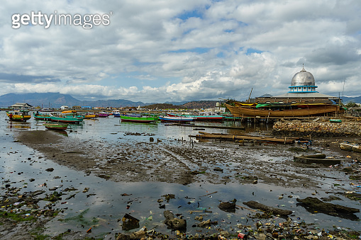 Sape harbour fishing town scene on low tide many traditional wooden ... Sape harbour fishing town scene on low tide many traditional wooden ...