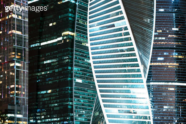 Modern glass buildings in business district side view, night light 이미지 ...