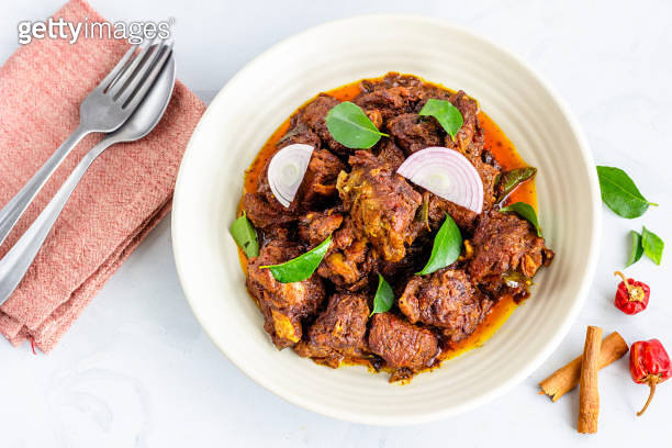 Indian Lamb Masala/Mutton Masala Garnished with Onion, Curry Leaves and ...