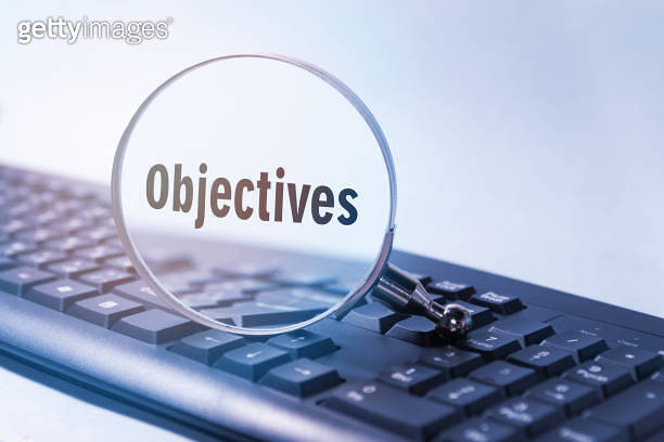 Magnifying glass with text Objectives on on the keyboard. (1273753581 ...