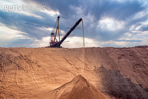Industrial background. Salt mining site under a sky with dramatic ...