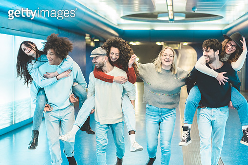 Happy friends having fun in underground metropolitan station - Young ...