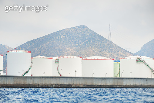 Oil terminal and cargo port, close-up view from the sailing boat ...
