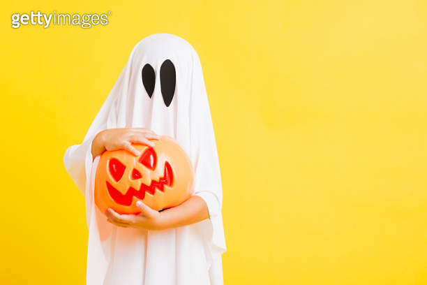 little cute child with white dressed costume halloween ghost scary he ...
