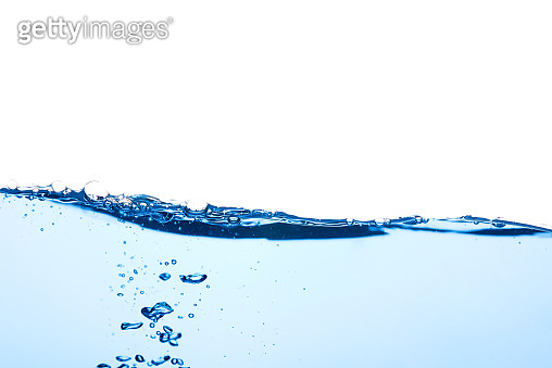Light blue water wave with air bubbles and a little bit splashed ...