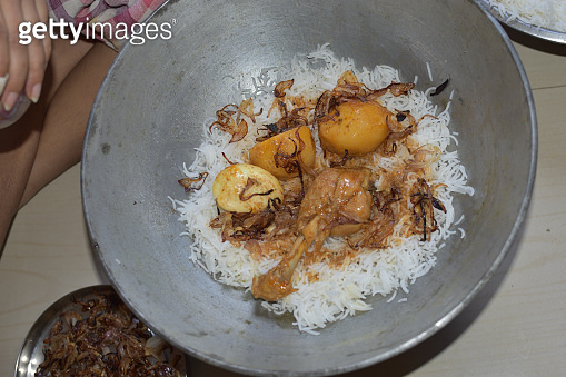 Delicious spicy homemade chicken biryani making in bowl by an indian ...