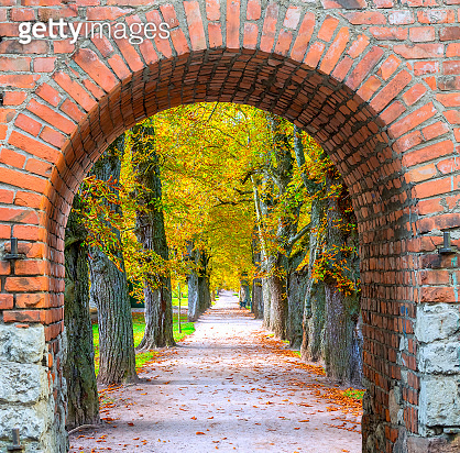 Ancient brick arch with entrance to old public city park (1283001622 ...