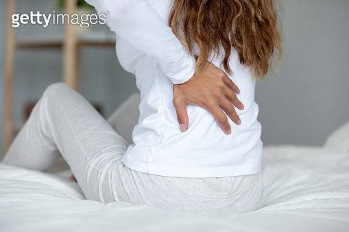 Hurt young woman touch back suffer from spinal pain 이미지 (1252119990 ...