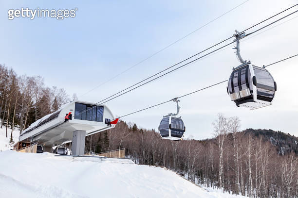 Upper passenger disembarkation point of a gondola cableway with a booth ...