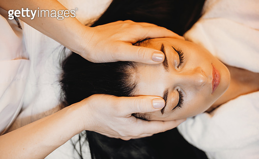 Facial massage done by a professional masseur at the spa salon for a ...