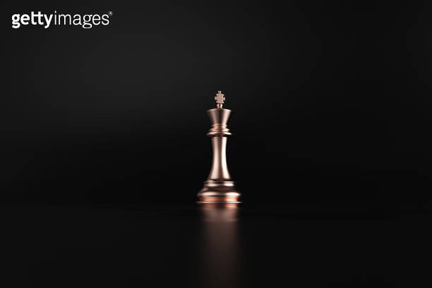 bronze chess piece, lonely king on chessboard stock photo (1204443399 ...