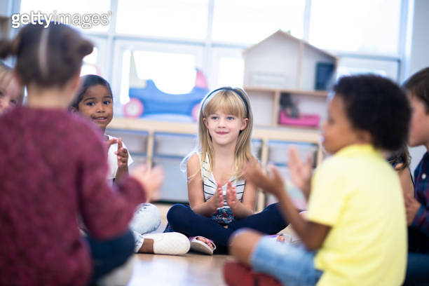 Kindergarten Class Singing and Clapping During Circle Time stock photo ...