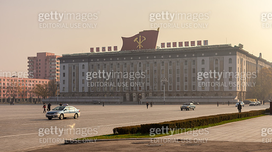 Kim Il-sung Square and government buildings decorated with flags and ...