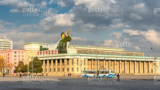 Kim Il-sung Square and government buildings decorated with flags and ...