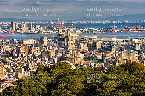 Kobe city skyline with Kobe port and Osaka bay in the distance in Kobe ...