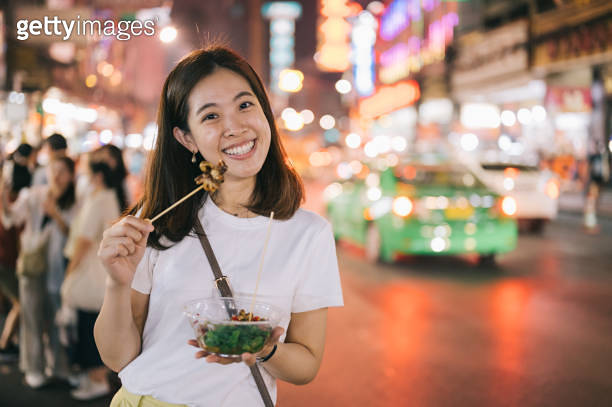 Young attractive asian traveller enjoy walking street at night ,woman ...