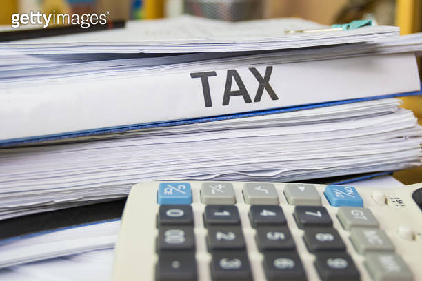 Folder Tax documents and paper files with calculator concept Annual tax ...
