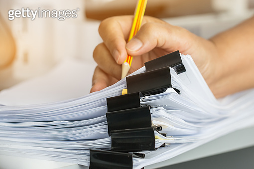 Businessman hands searching and checking write unfinished documents ...