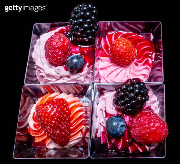 Delicious mix of red fruit mousse desserts. Strawberries, raspberries ...