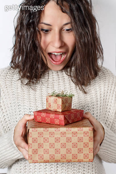 Surprised young woman holding Gifts in hands close up 이미지 (1281458192 ...