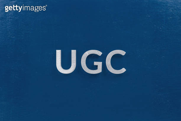 the word ugc - user generated content - laid by white silver metal ...