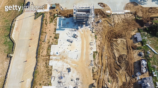 Aerial view construction site with elevator shaft towers and building ...