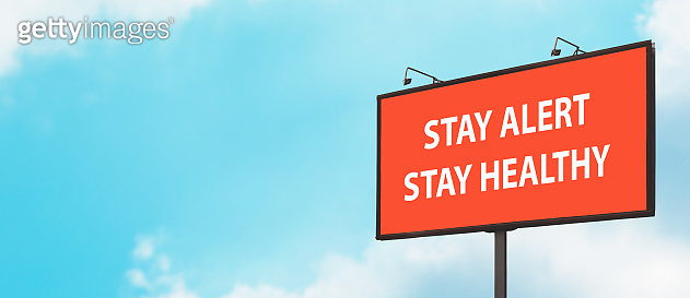 Stay Alert Stay Healthy warning sign on blue sky background. Large ...
