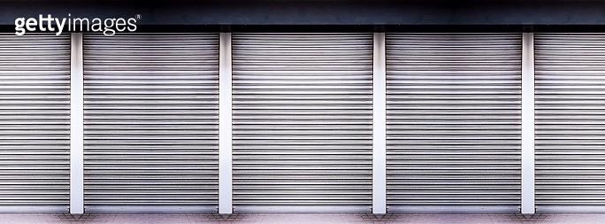 Closed steel shutter door of warehouse, storage or storefront for metal ...