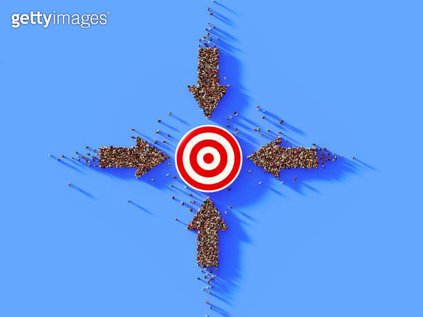 Human Crowd Forming Four Arrow Symbols Around A Red Bulls Eye ...