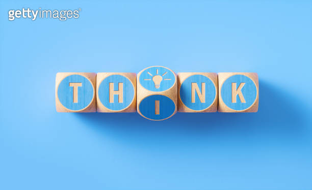 "Think" Written Blue Wood Blocks Sitting on Blue Background (1256170933 ...