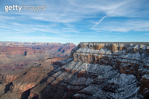 Snow dusted view of south rim of Grand Canyon, north rim in distance ...