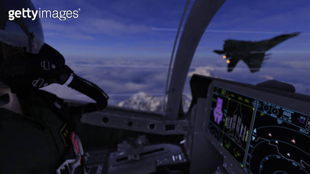 Jet fighter pilot viewing enemy aircraft on left wing in cockpit view ...