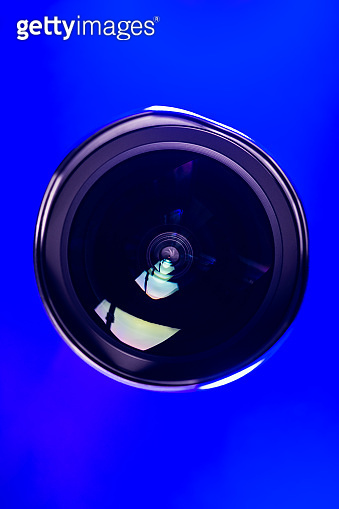 The camera lens with blue backlight. Optics. Vertical photo 이미지 ...