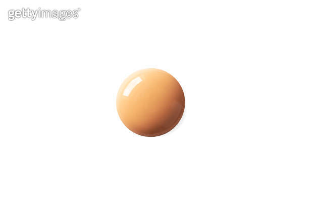 Beige liquid creamy foundation round drop with luminous finish ...