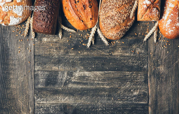 Bread border on wood background with copy space. Whole grain loaves ...