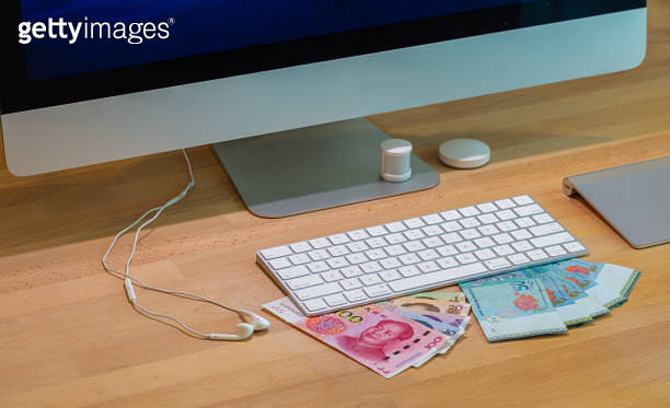 Chinese yuan and malaysian ringgit on a computer keyboard (1218201721 ...