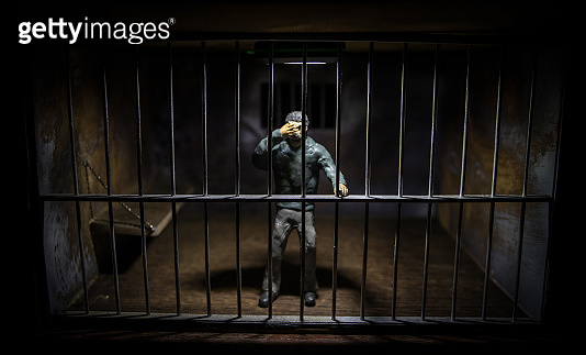 Jail or prison cell. Man in prison man behind bars concept. Old dirty ...