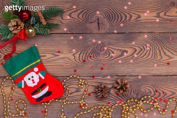 Red stocking with the image of Santa and Christmas decorations, beads ...