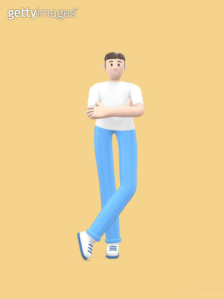 A young cheerful guy is standing in a free pose of his hands on his ...