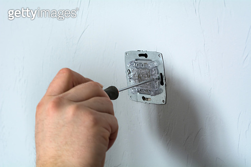 Socket plug installation. Disassembled electrical outlet in detonation ...