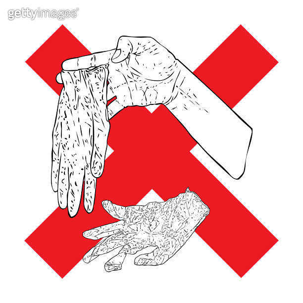 Hand throwing litter or trash, disposable medical used rubber gloves on ...