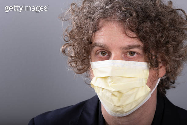 Close up of a man wearing a mask over his face during the Covid-19 ...
