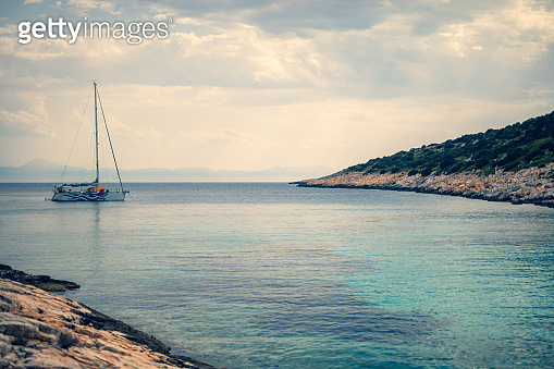 Sailing boat at distant remote island paradise with exotical vivid ...