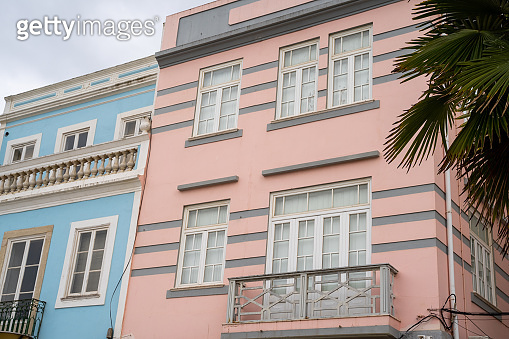 Pastel pink and blue buildings in Lagos, Portugal, in the Algarve ...