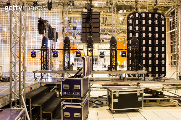 Spotlight devices on a truss. Line array speakers. Big led screen ...