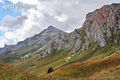 beautiful mountain landscape with a rocky ridge in the distance and an ...