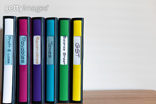 Set of color coded files and binders used by bookkeeper and accountant ...
