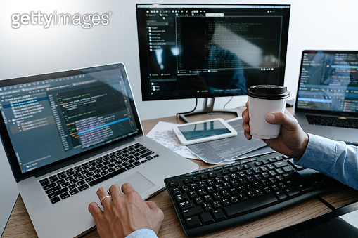 Programmer Typing Code on desktop computer, Developing programming and ...