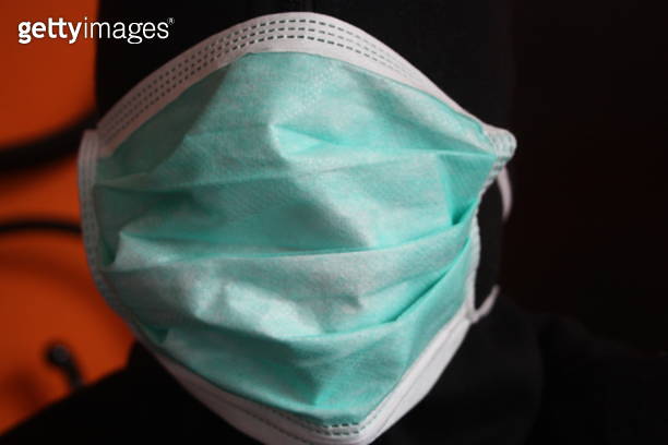 Unrecognizable hooded mysterious individual with dark sweatshirt wears ...